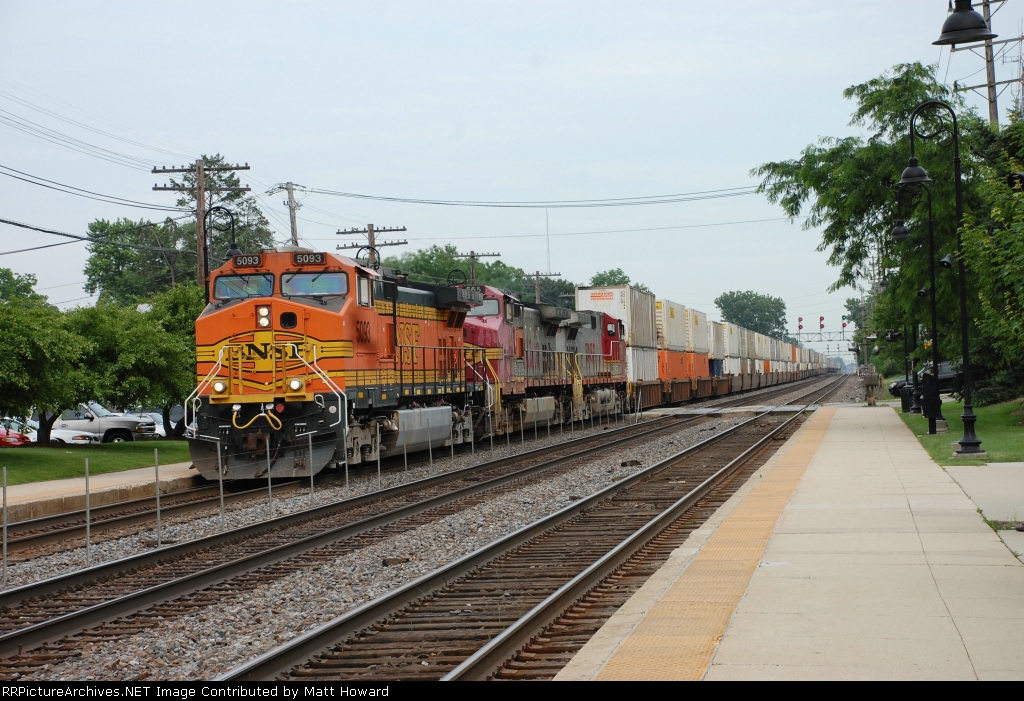 A westbound stack train with two warbonnets heads west.